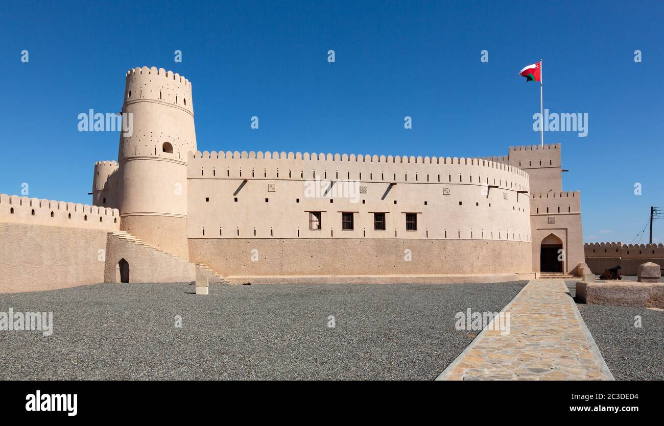 Exterior view of fort of Bani bu Hassan in Oman, with raised Omani flag ...