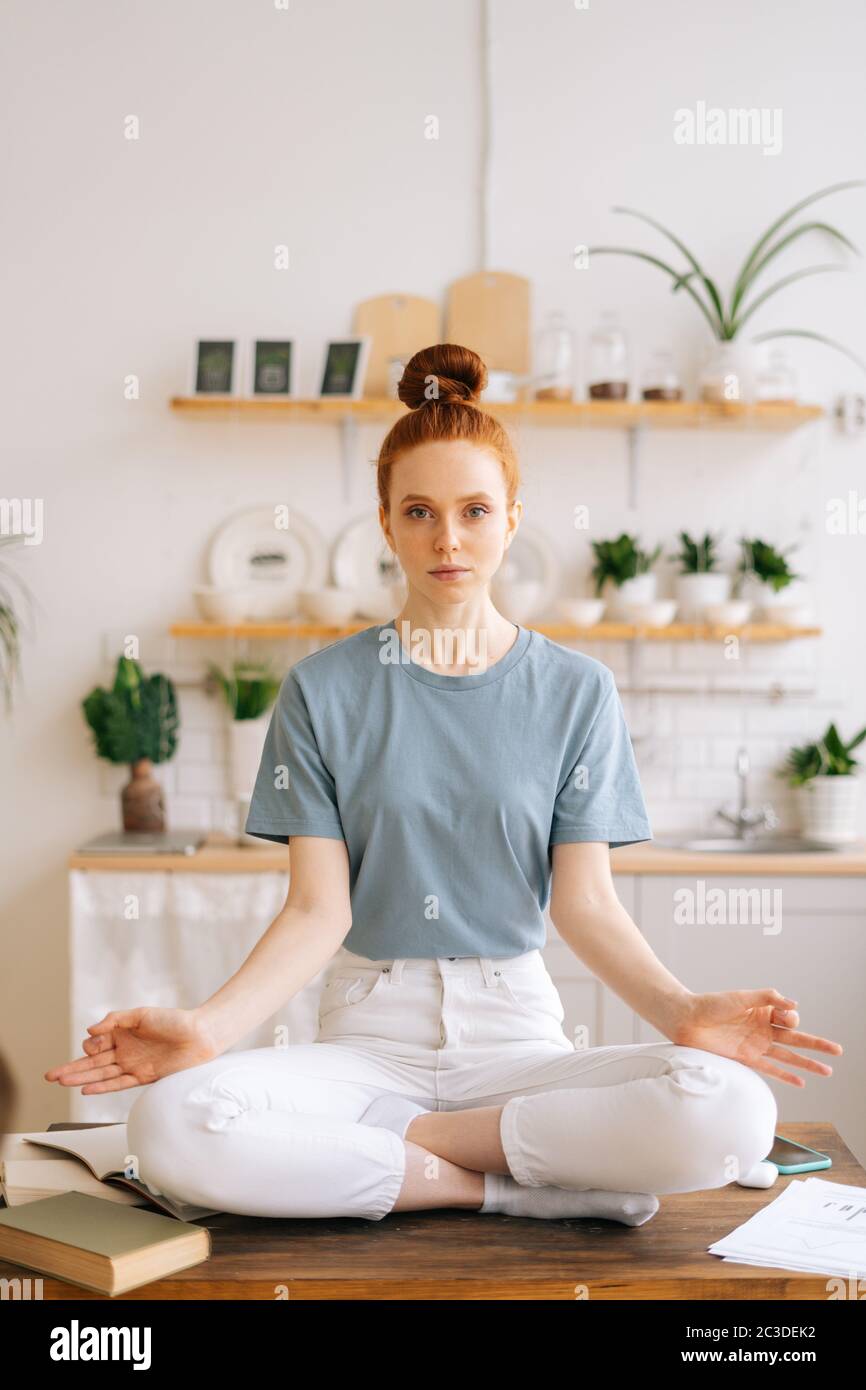 Business woman meditating on desk hi-res stock photography and images ...