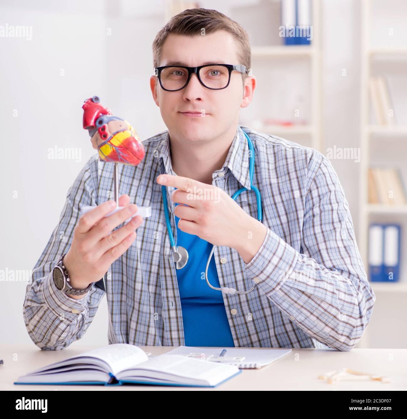 Medical student studying heart in classroom during lecture Stock Photo ...