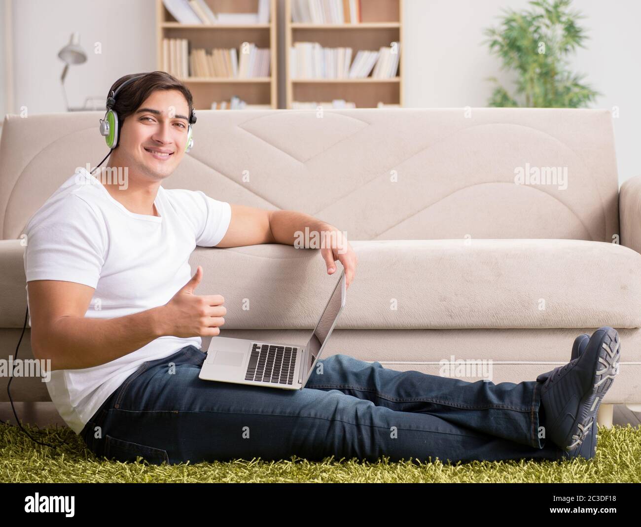 Freelancer working at home and listening to music Stock Photo - Alamy