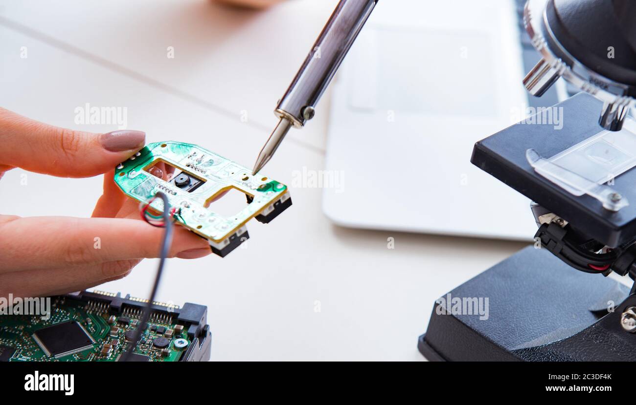 Woman fixing motherboard hi-res stock photography and images - Alamy