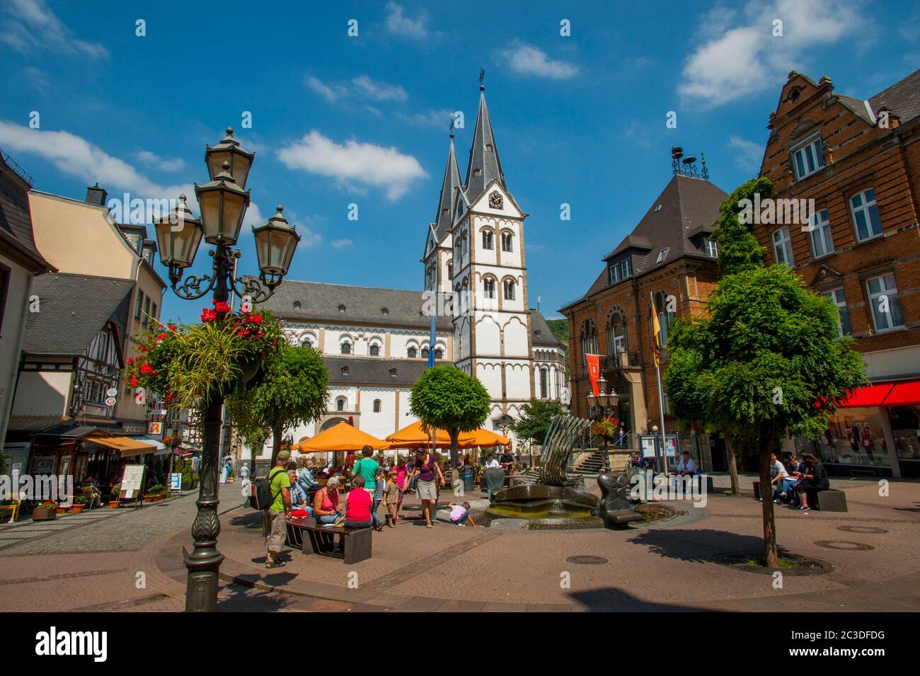 The market square with the Romanesque church of St. Severus and its two ...