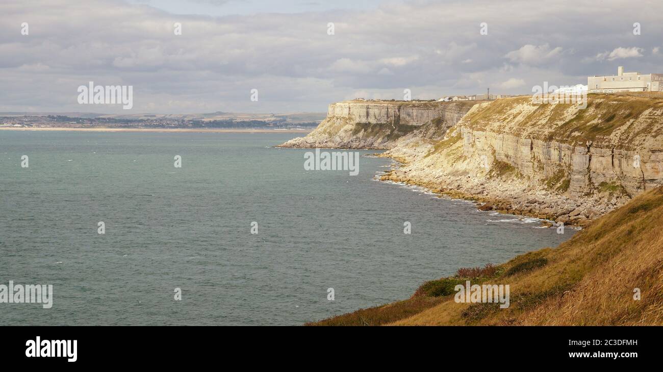 Climbing at the cliffs of the Isle of Portland in Dorset, England ...
