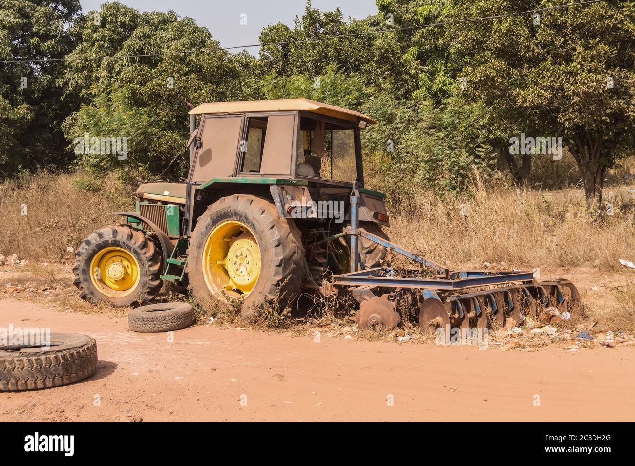 Old rusty abandoned tractor Stock Photo - Alamy