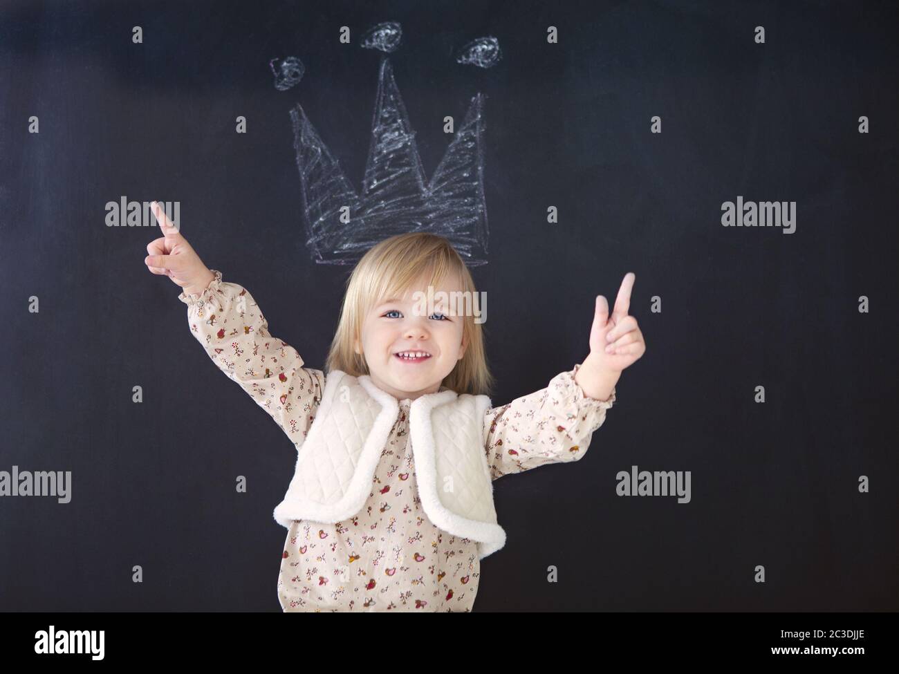 Happy little princess smiling for camera Stock Photo - Alamy