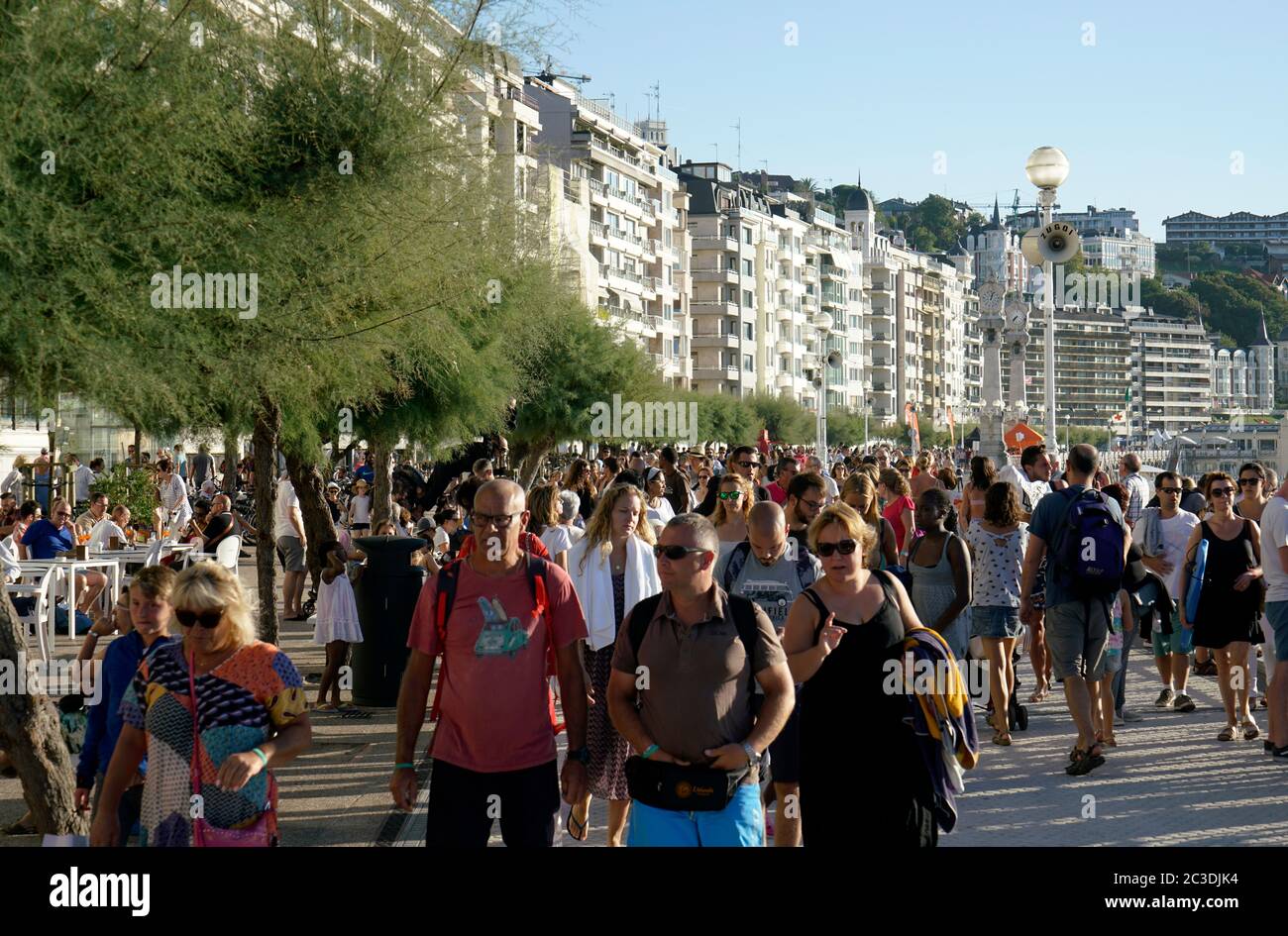 People on the promenade of La Concha Beach. La Concha Bay.San Sebastian ...