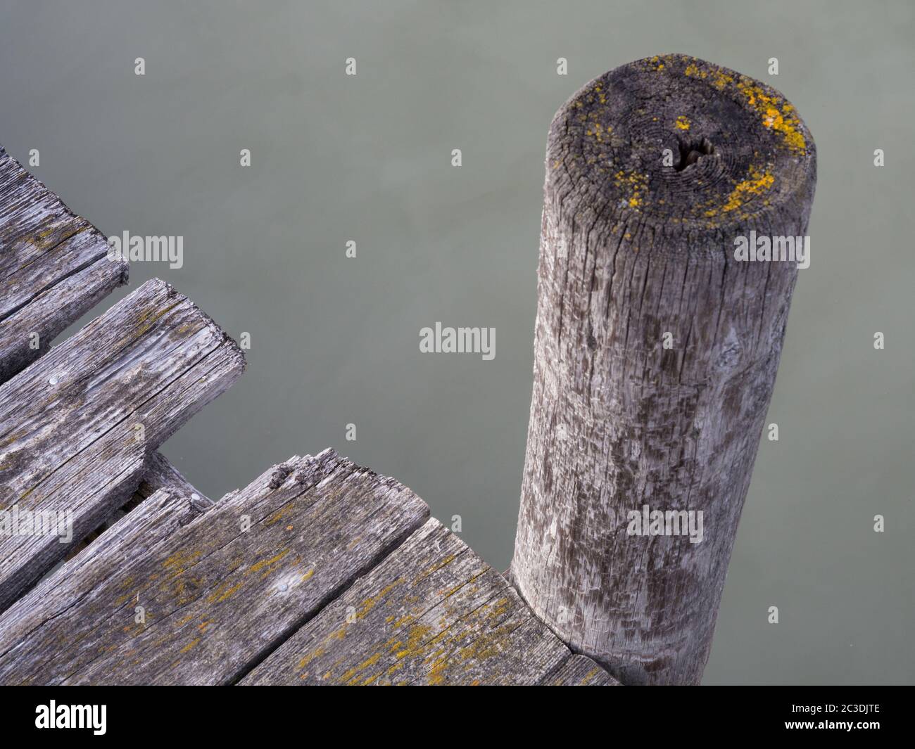 Wooden pile on a jetty on lake neusiedlersee Stock Photo - Alamy