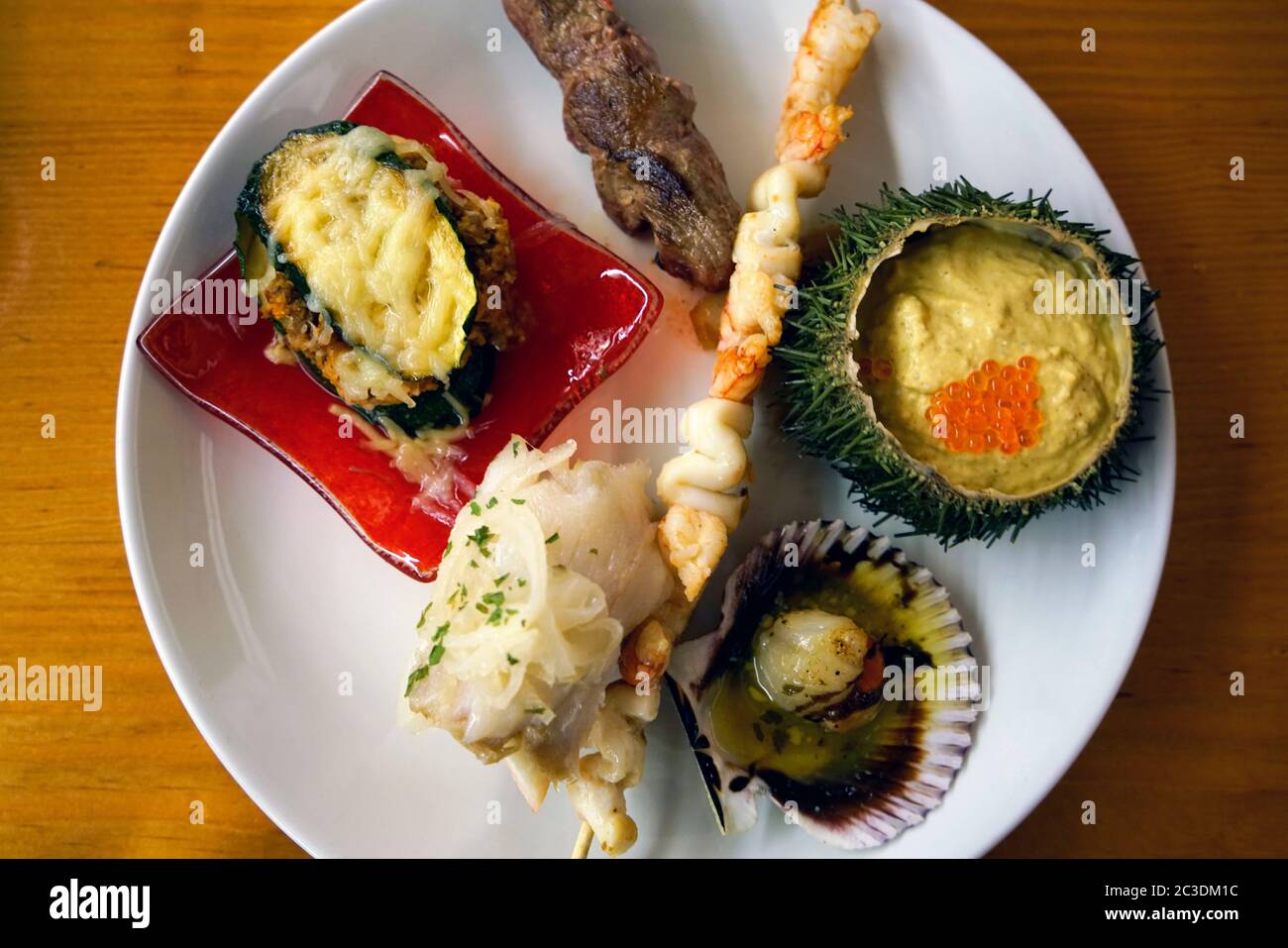 Different types of Pinchos served in a plate in a Pincho bar restaurant ...