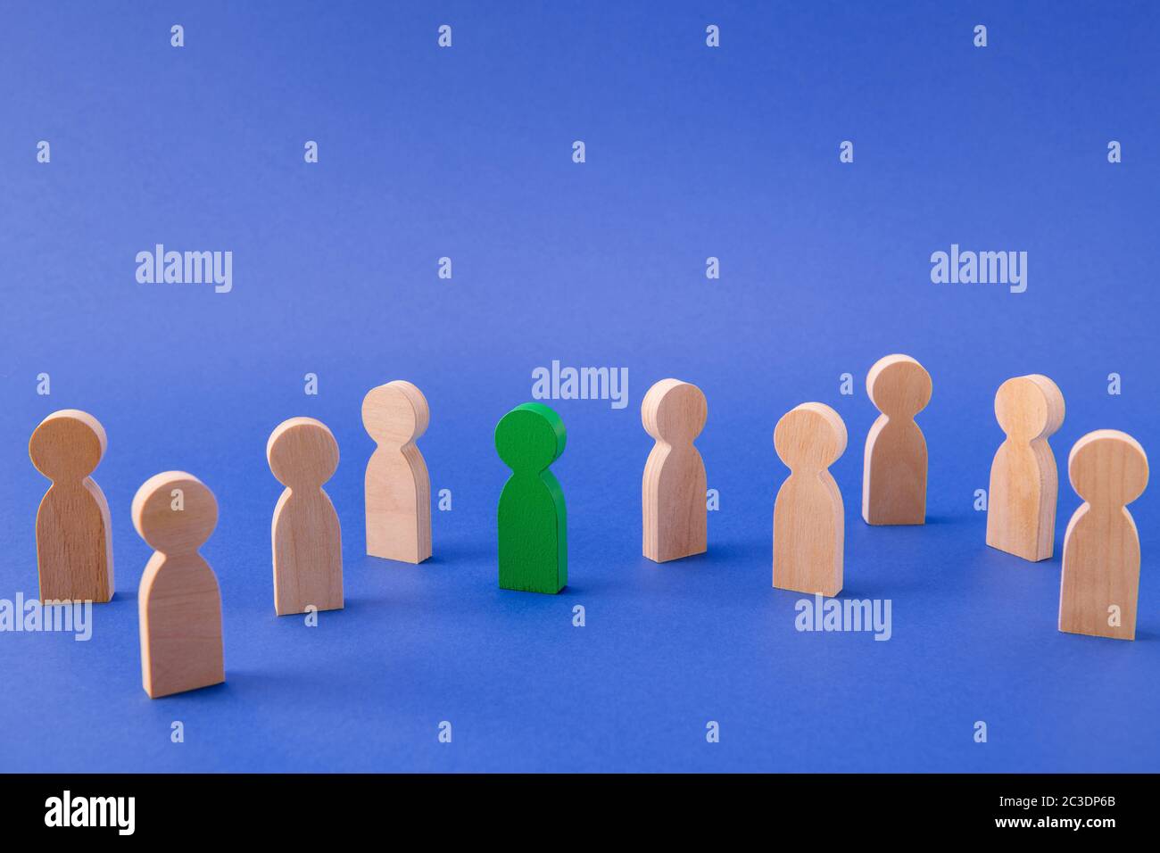 Crowd of wooden faceless people figures different social layers walking ...