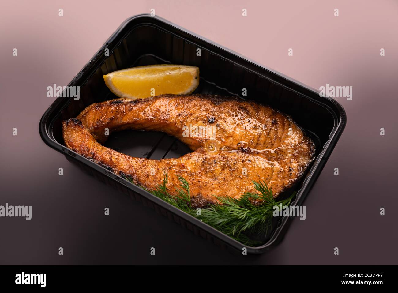 Fish steak with lemon view Stock Photo - Alamy