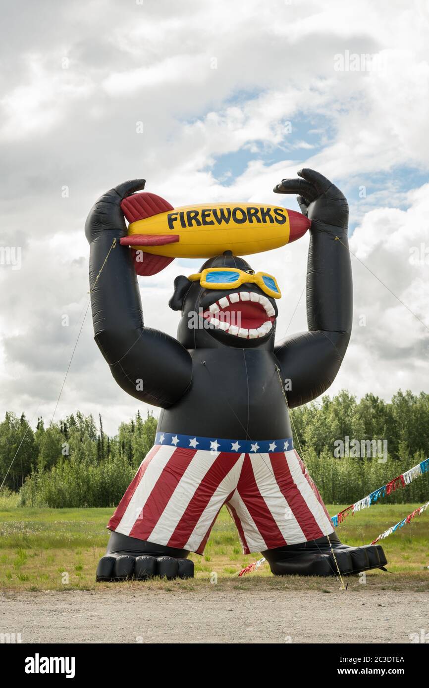 A giant inflatable gorilla outside a fireworks stand in a rural section ...