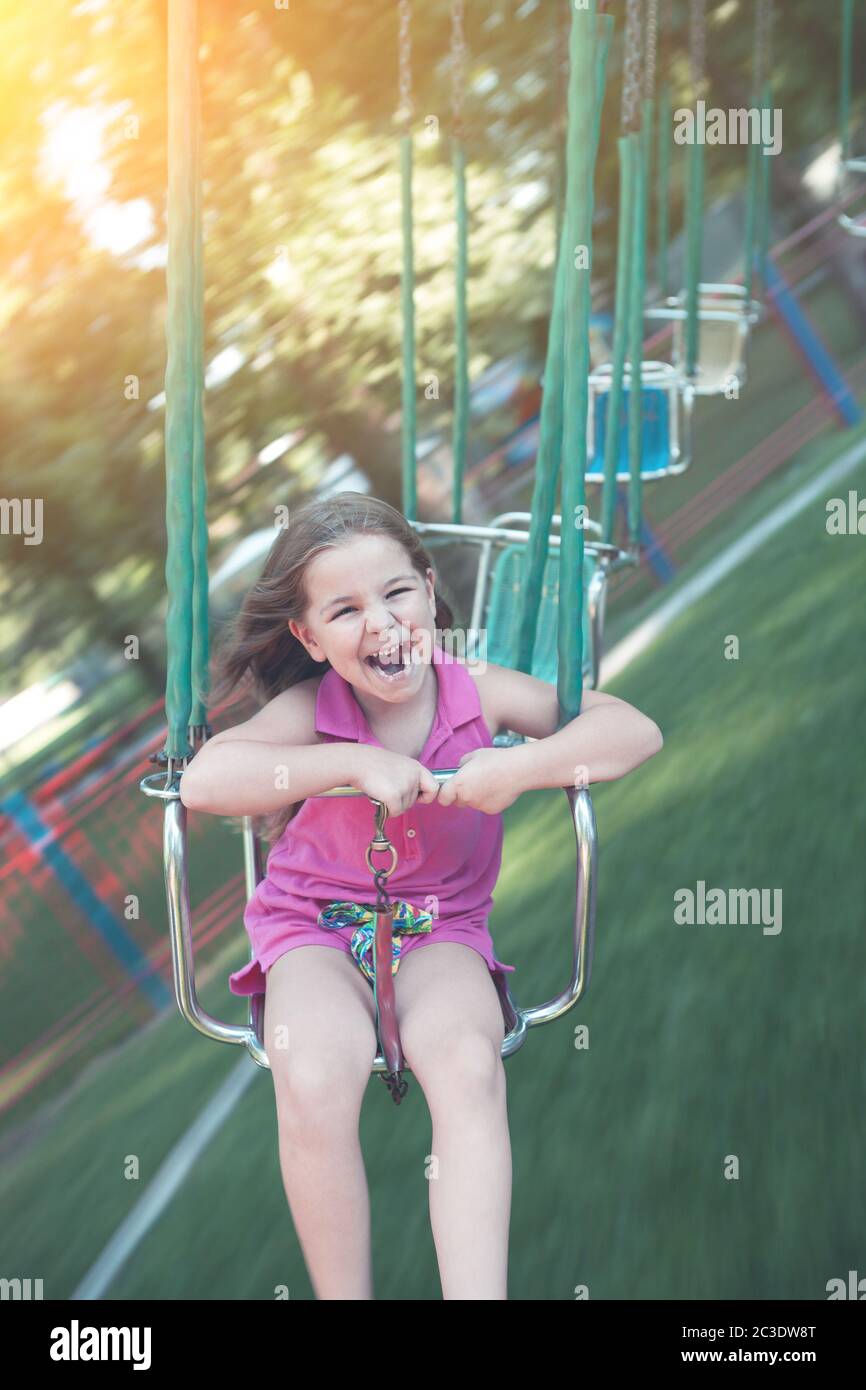 Child riding carousel hi-res stock photography and images - Alamy