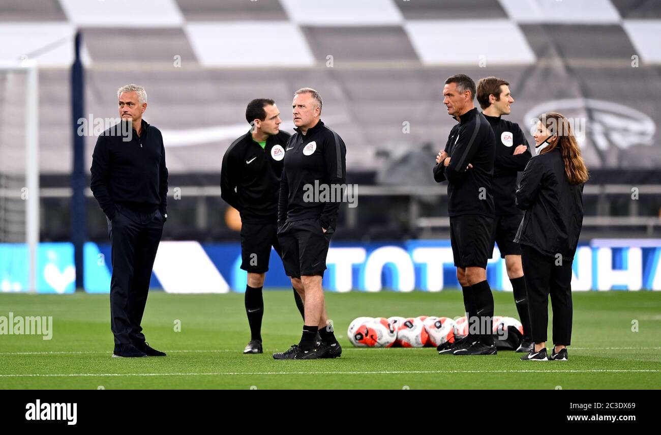 Tottenham Hotspur manager Jose Mourinho (left) with the match officials ...