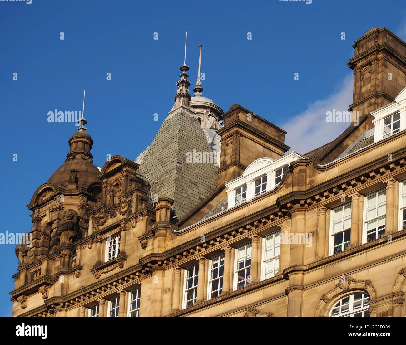 ornate stone towers and domes on the roof of leeds city market a ...
