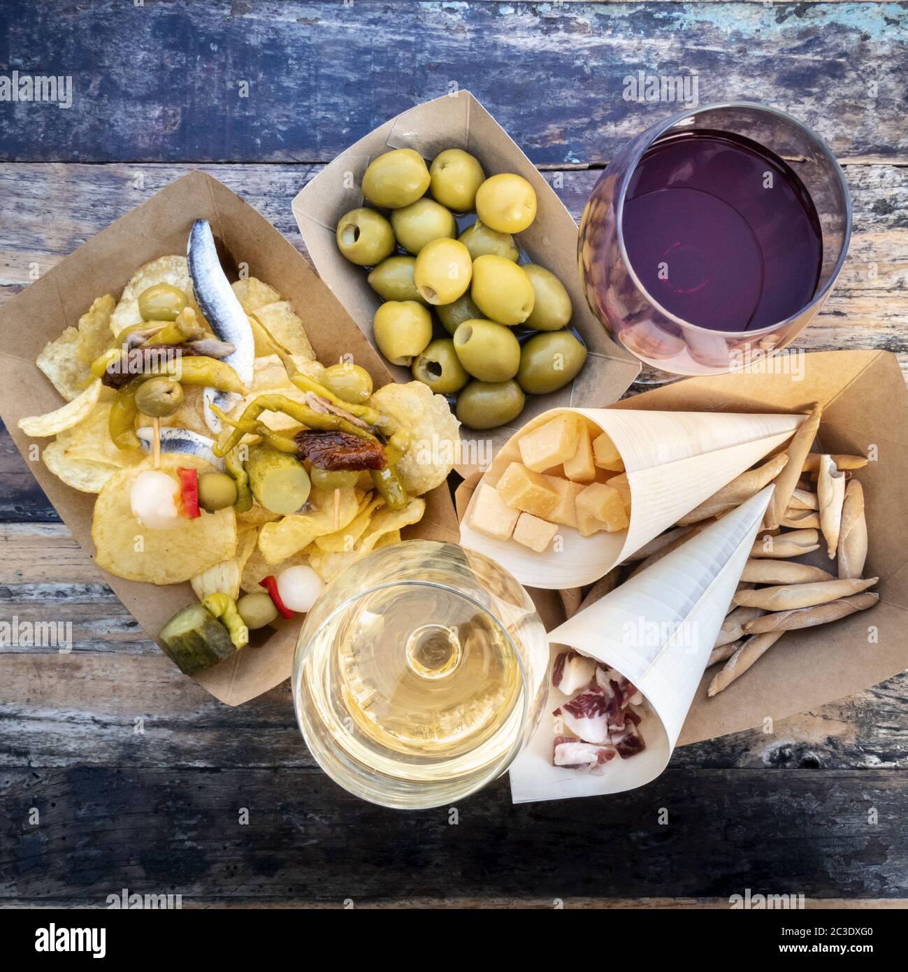 Tapas and pinchos, overhead square shot. Cheese, jamon and olives ...