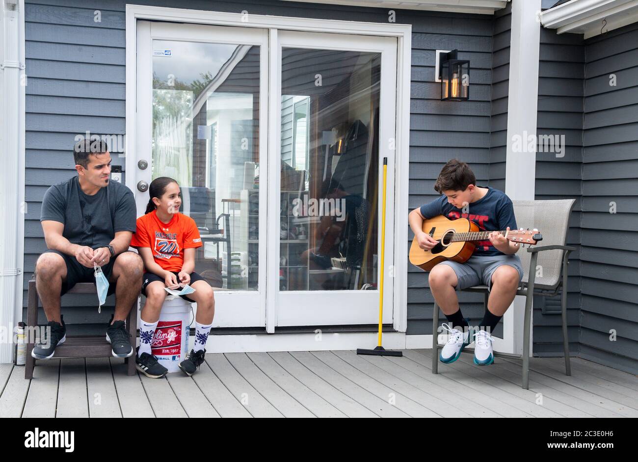 Puerto Rican graphic designer David Torres and his two children at home ...