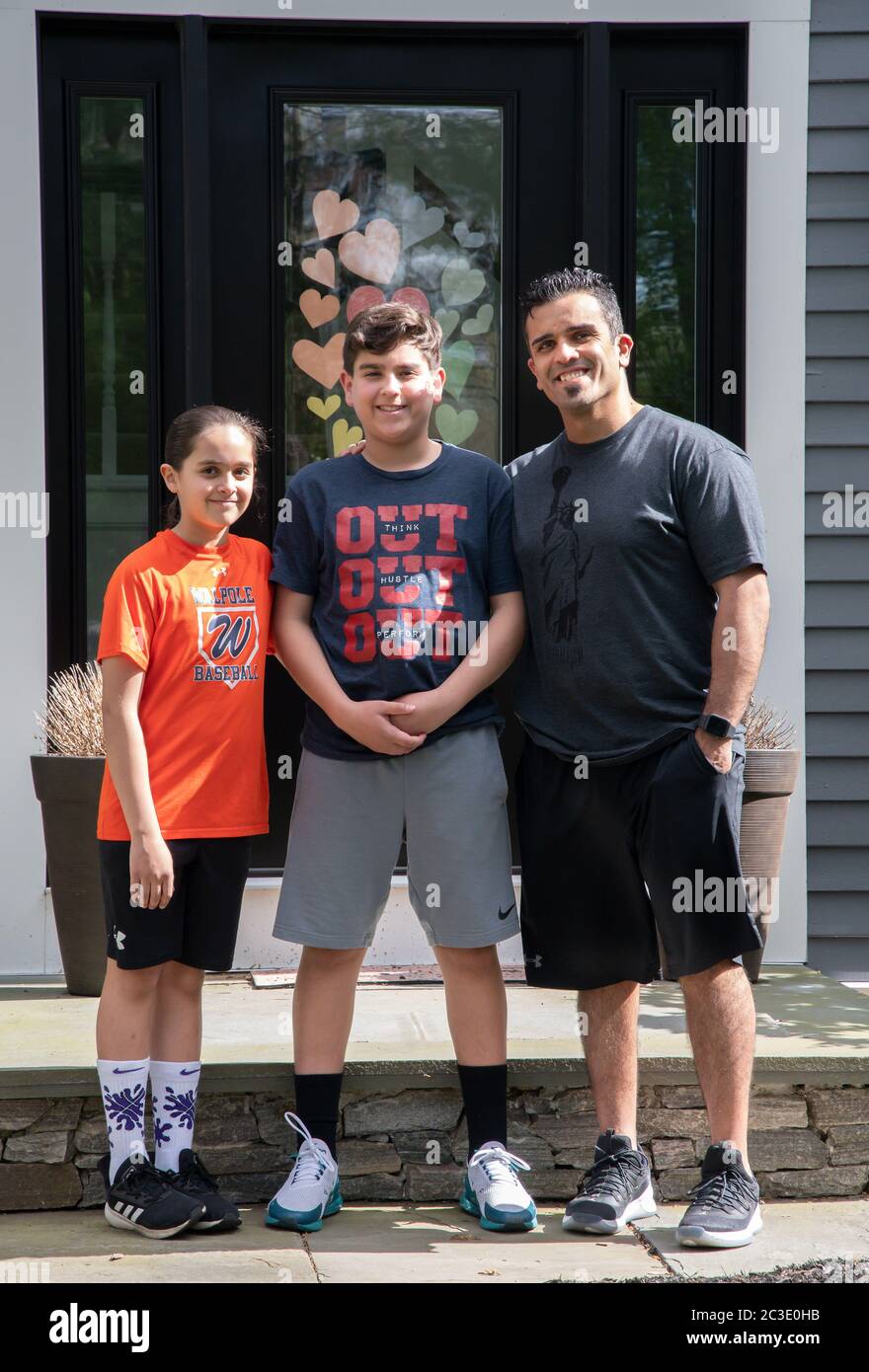 Puerto Rican graphic designer David Torres and his two children at home ...