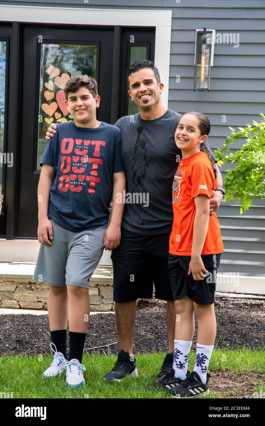 Puerto Rican graphic designer David Torres and his two children at home ...