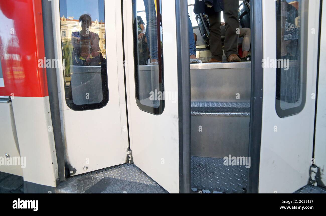 Closing or opening Bus doors of public transport and people traveling ...