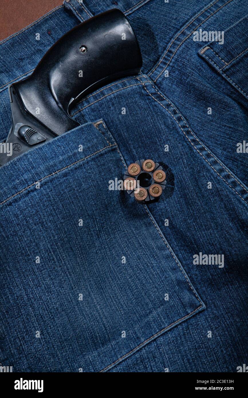 Gun And Denim Stock Photo - Alamy