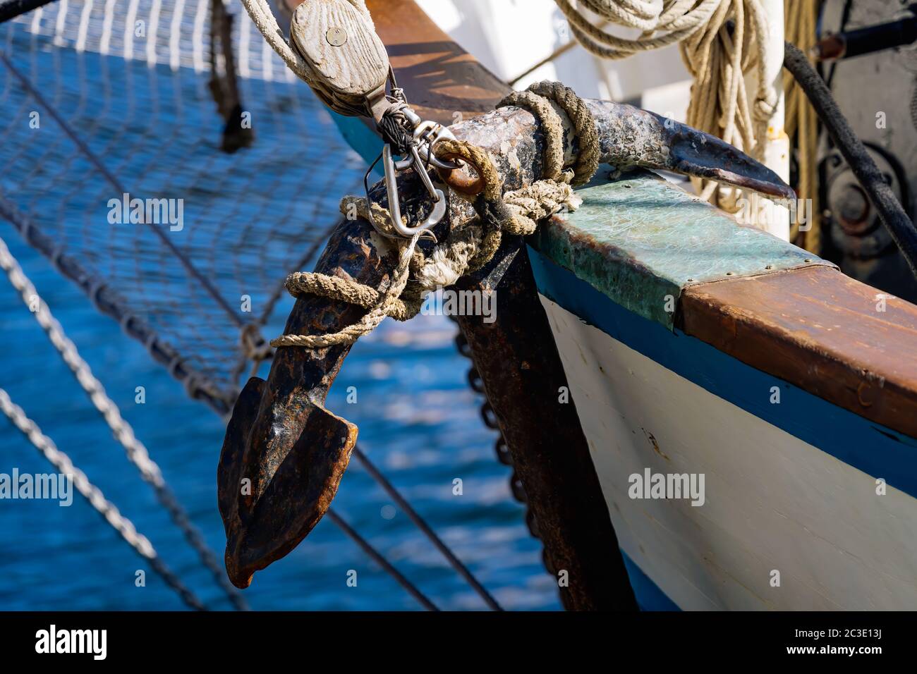 Details of the vintage rusted anchor hanging from an old sailing ship ...