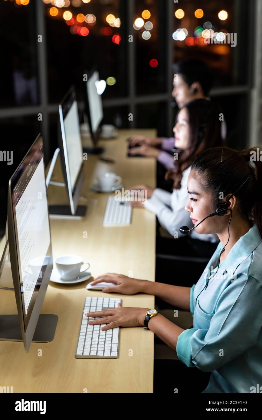 Call Center working at night Stock Photo - Alamy