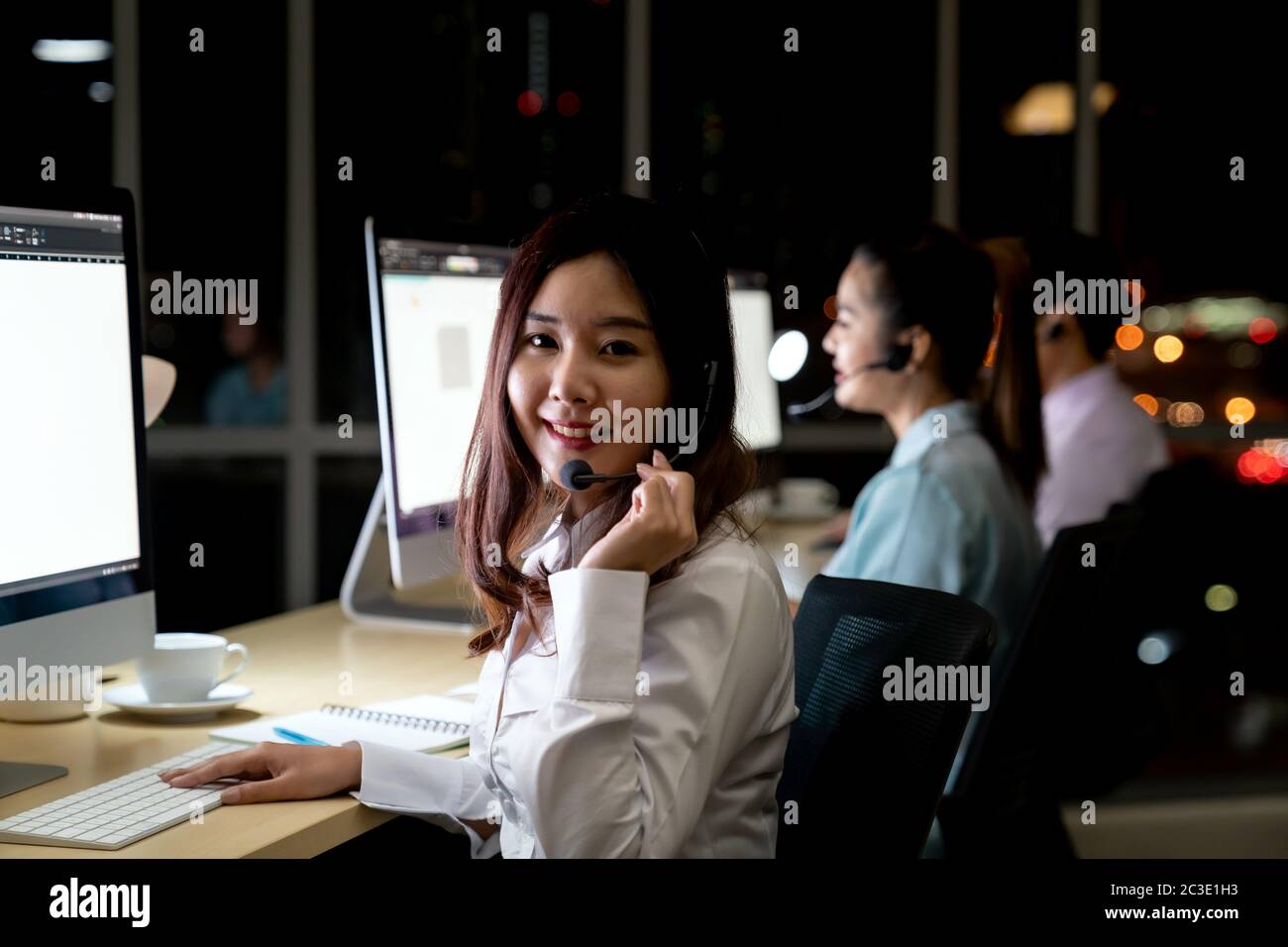 Call Center working at night Stock Photo - Alamy