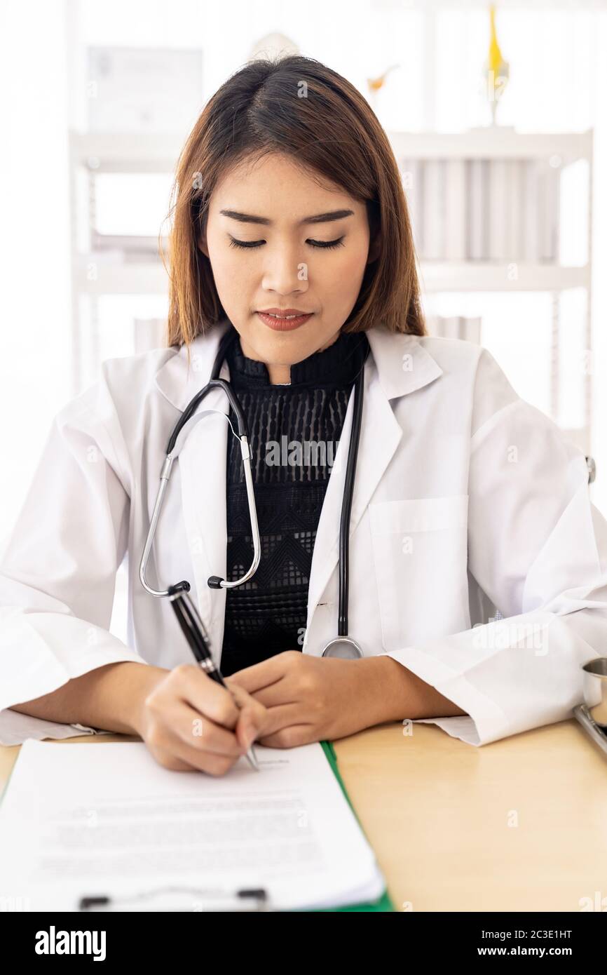 female doctor portrait sign document Stock Photo - Alamy