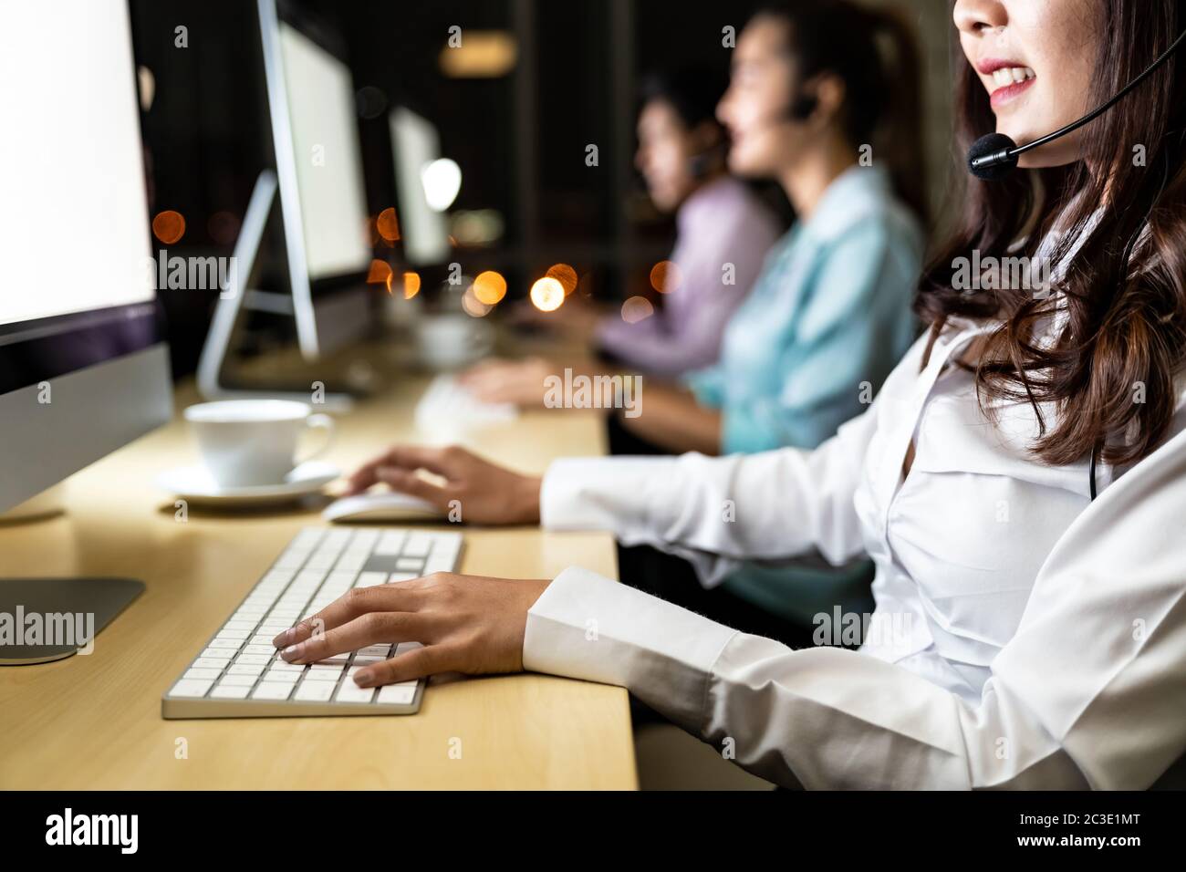 Call Center working at night Stock Photo - Alamy