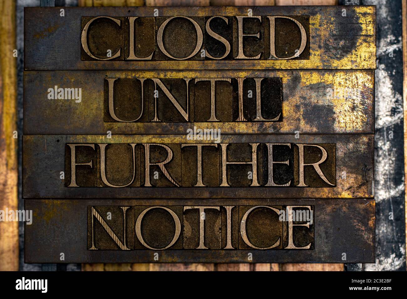 Closed Until Further Notice text formed with real authentic typeset ...