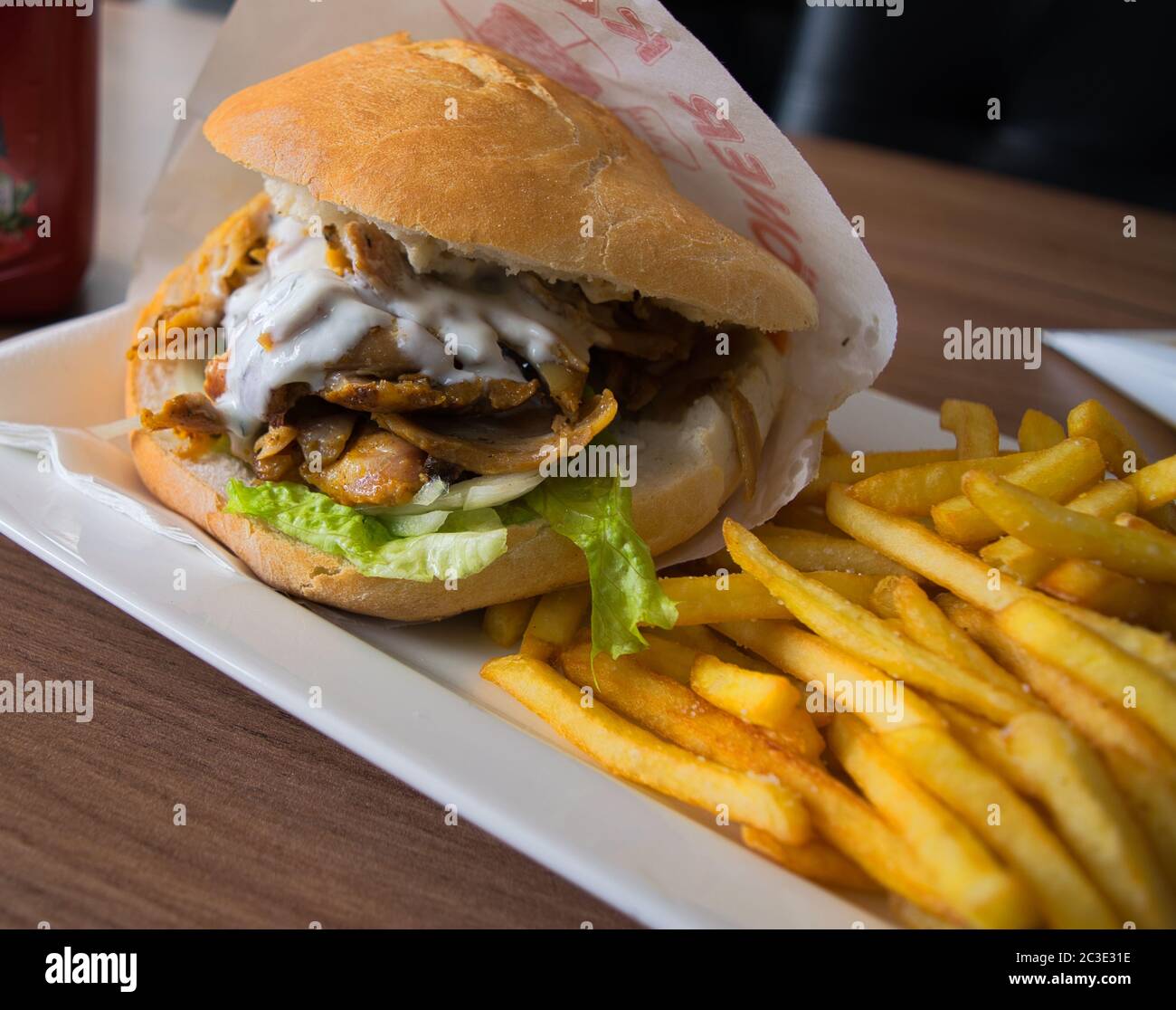 Turkish Kebab and potato fries french fries are served on the table ...