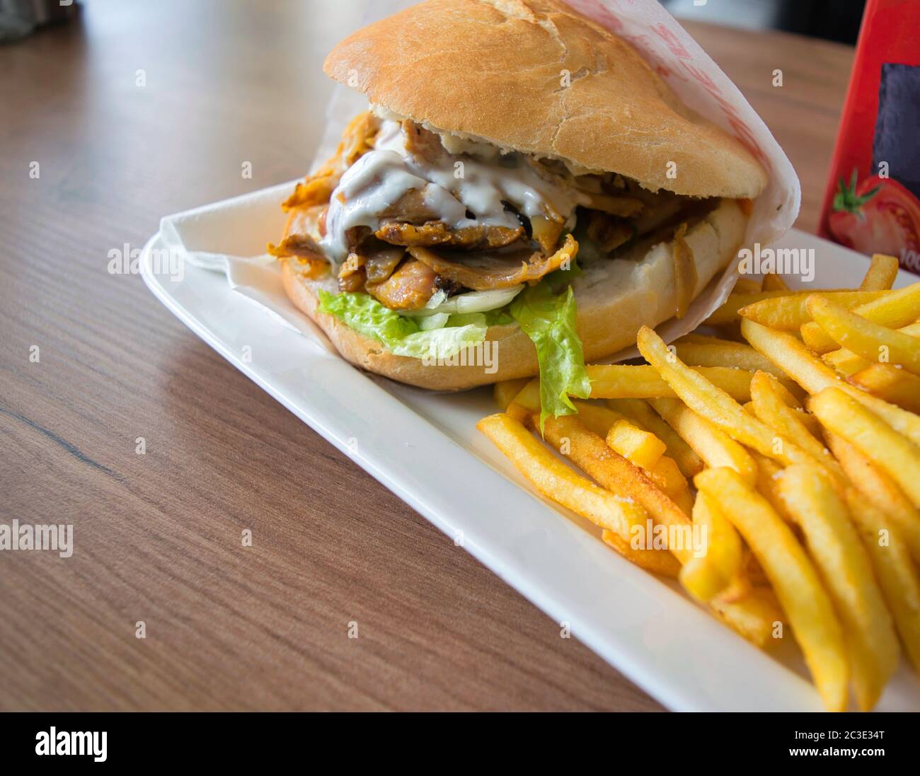 Turkish Kebab and potato fries french fries are served on the table ...