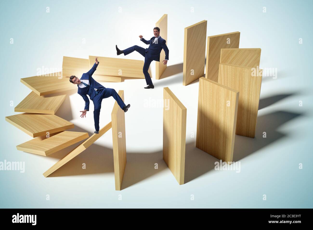 Domino effect and competition concept Stock Photo - Alamy