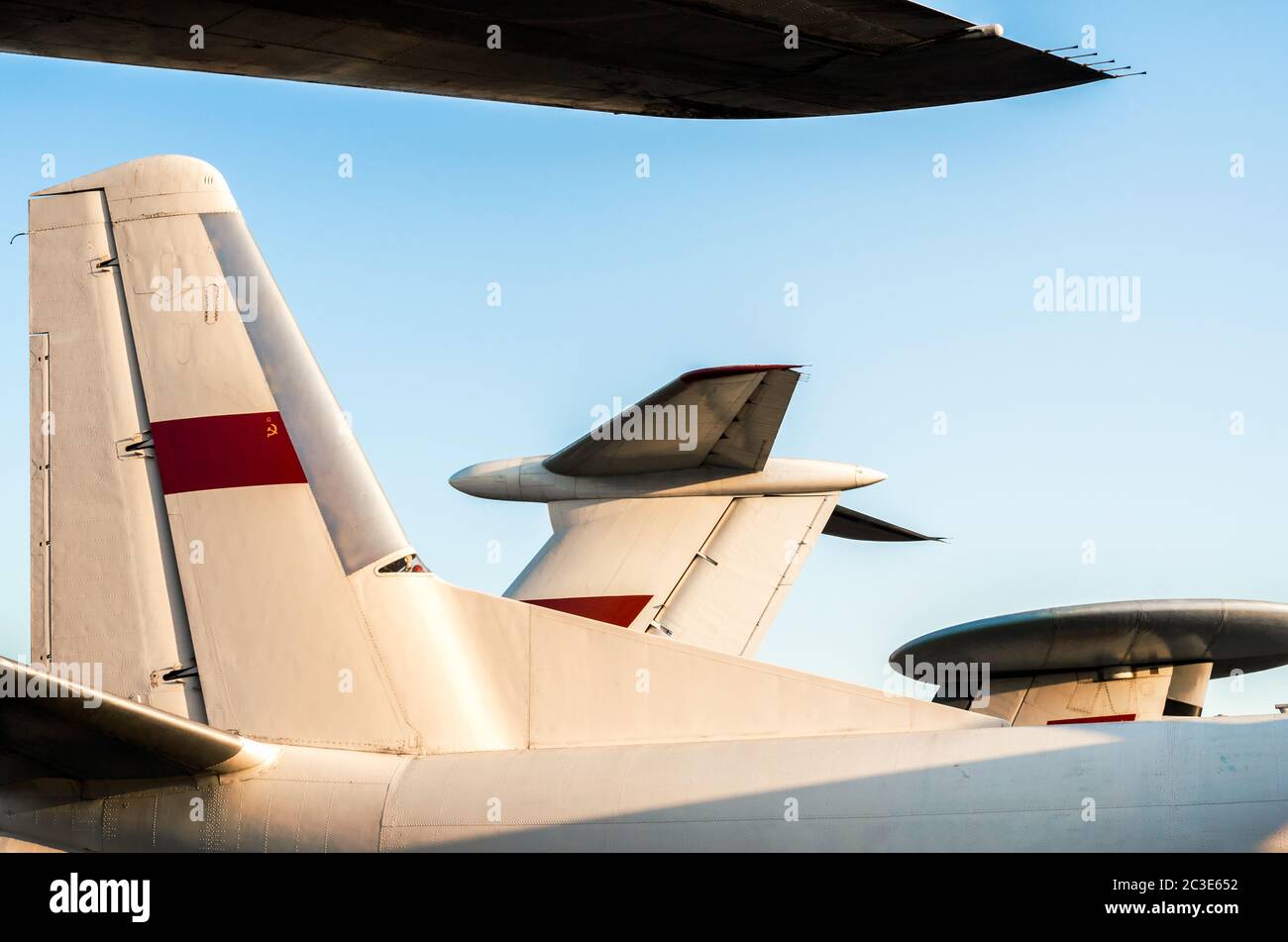 background wings of a large soviet airliner against a blue sky isolated ...