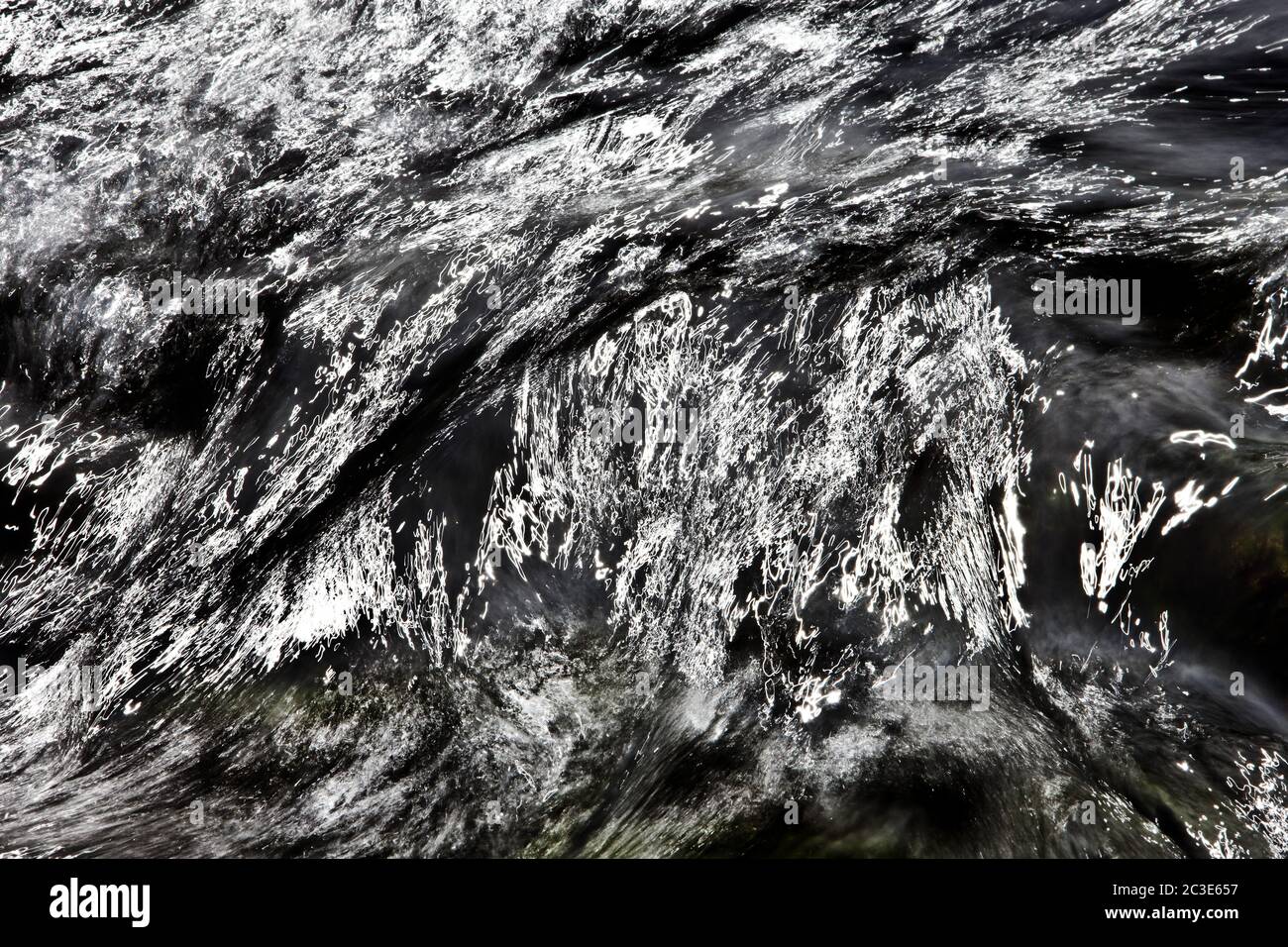 Sun reflexes showing the direction of the water flow hi-res stock ...