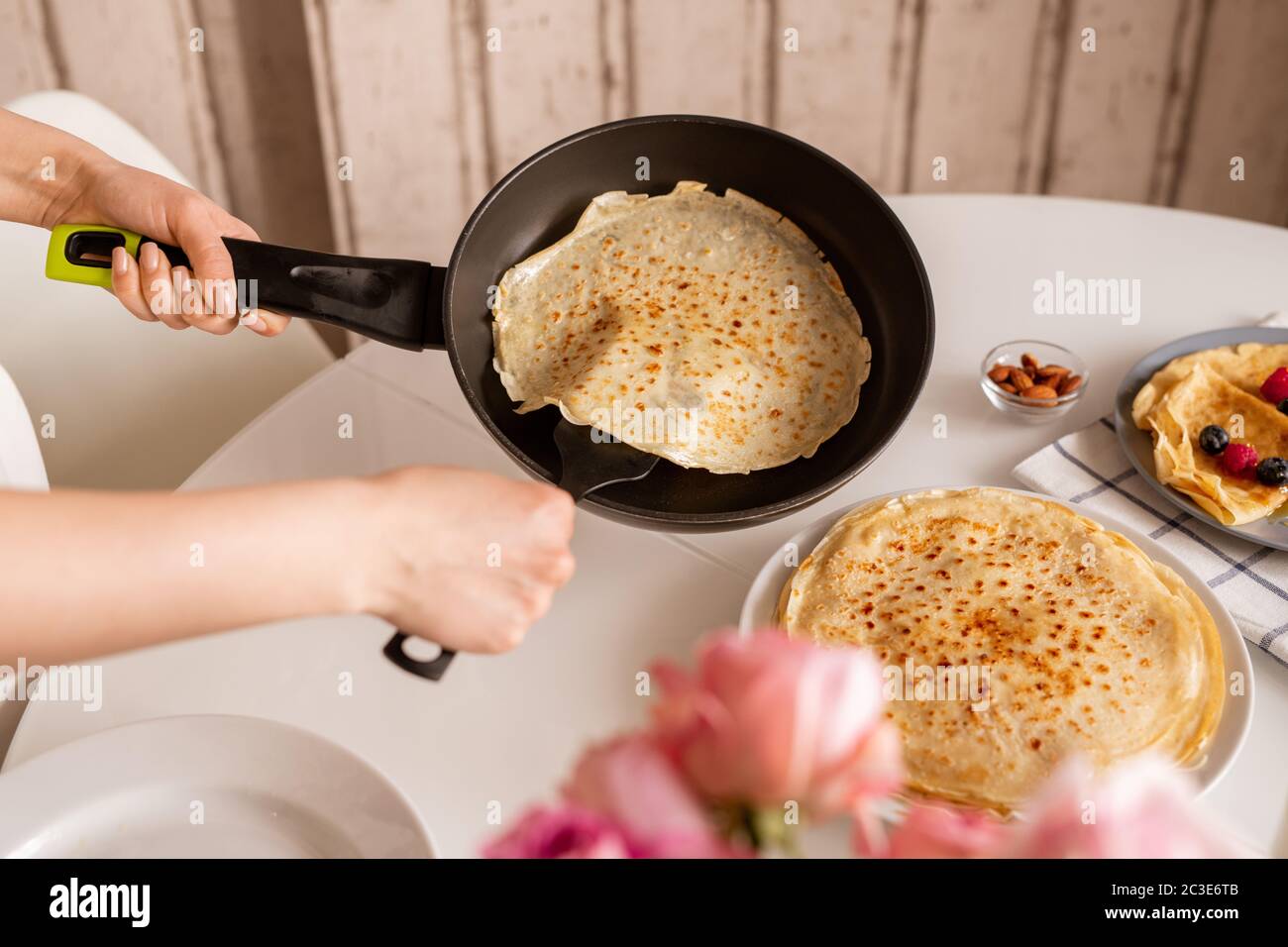 Woman hands put plate pancake hi-res stock photography and images - Alamy