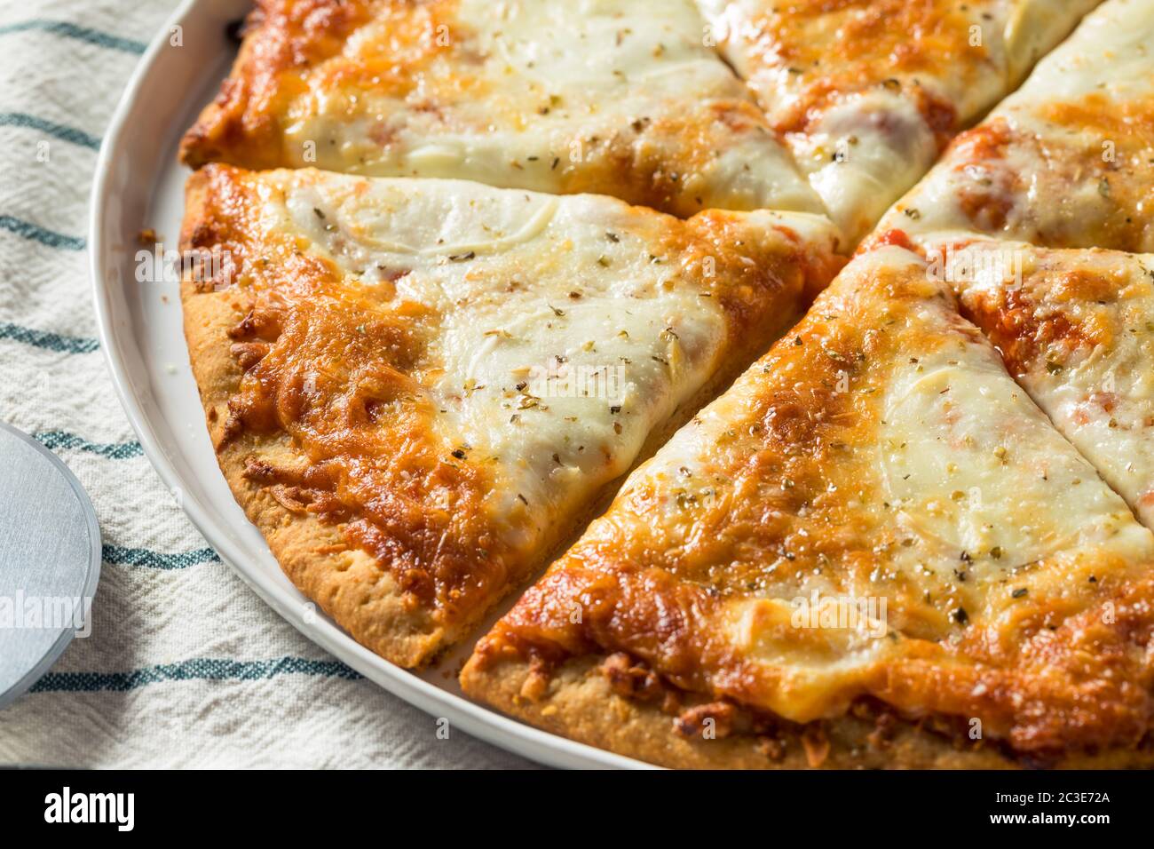 Cheesy Homemade Cheese PIzza Sliced and Ready to Eat Stock Photo - Alamy