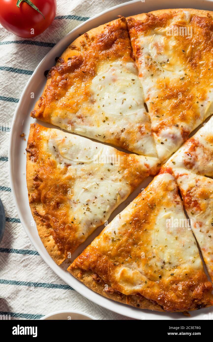 Cheesy Homemade Cheese PIzza Sliced and Ready to Eat Stock Photo - Alamy