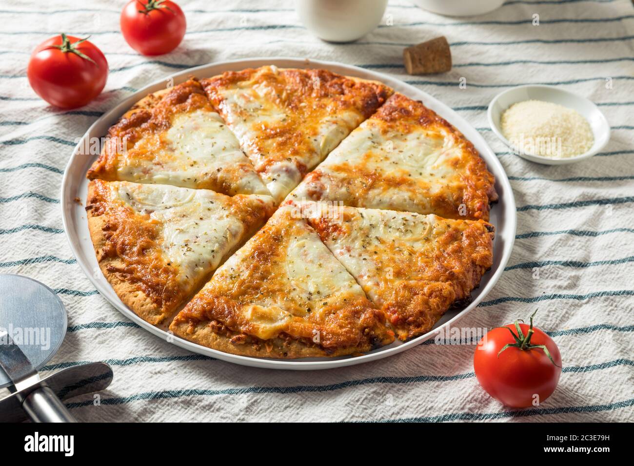 Cheesy Homemade Cheese PIzza Sliced and Ready to Eat Stock Photo - Alamy