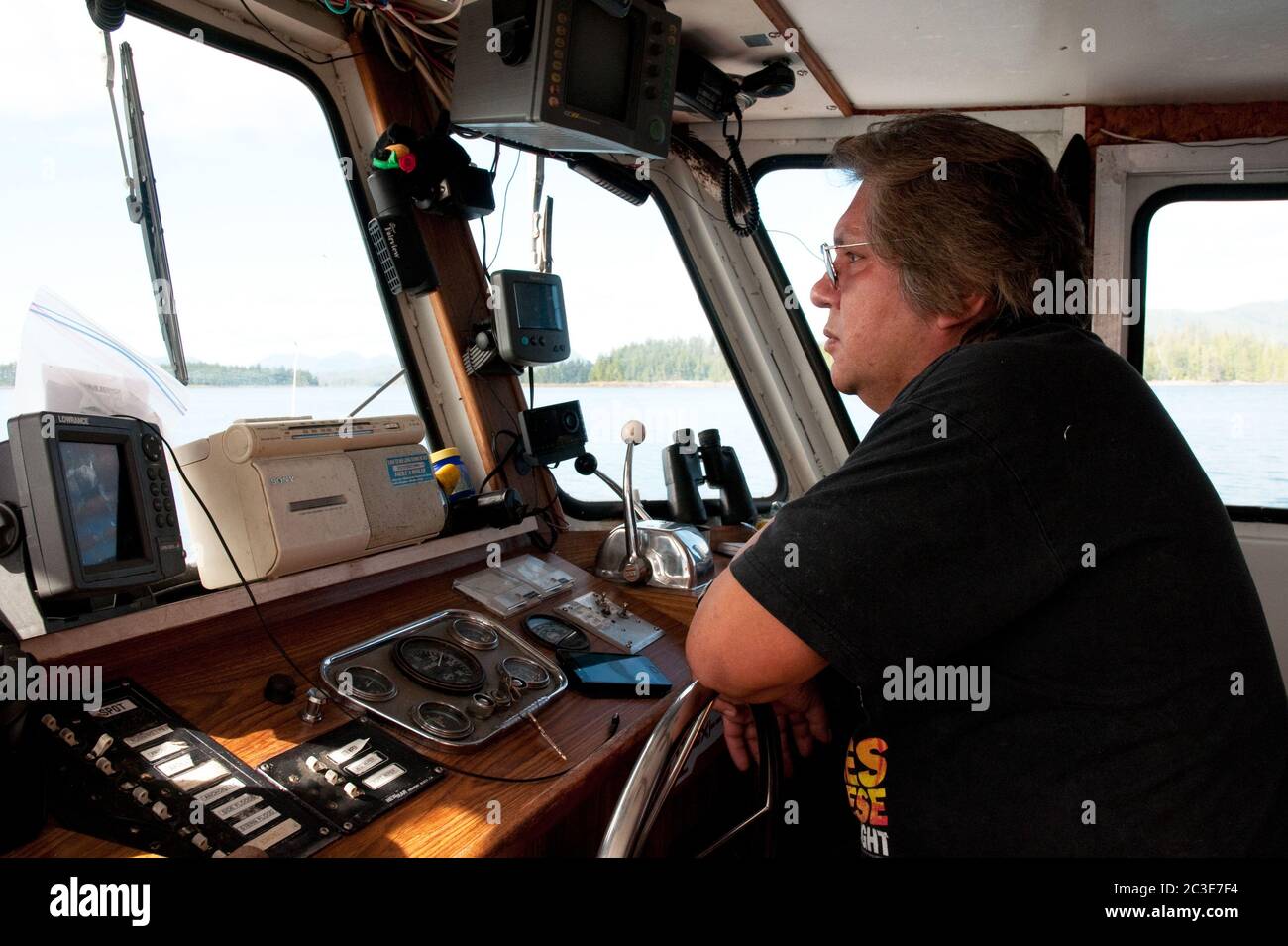 A small ferry boat captain plods through the Pacific waters of the ...