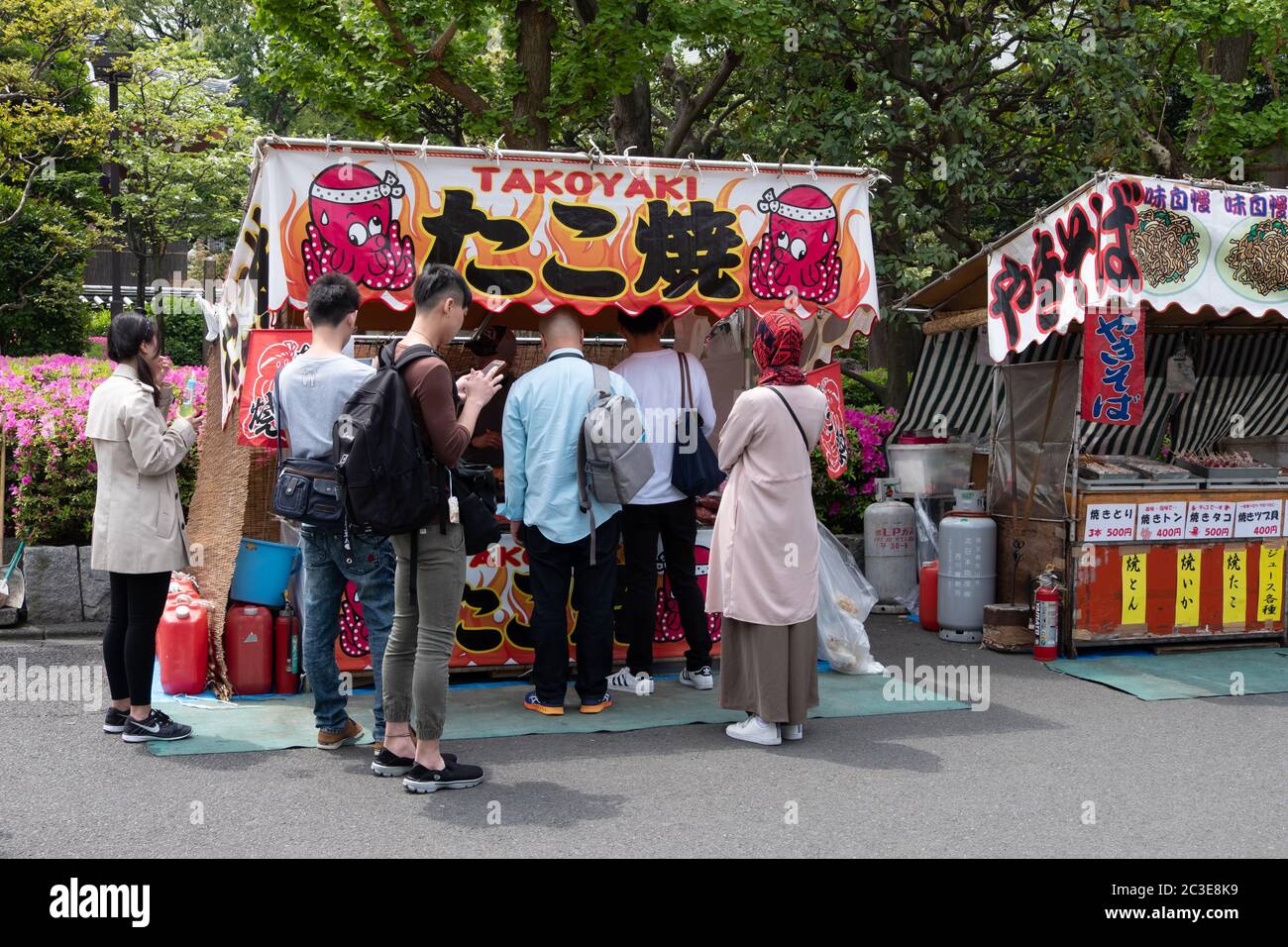 Visitors at food stall in Sensoji Temple, Tokyo, Japan Stock Photo - Alamy