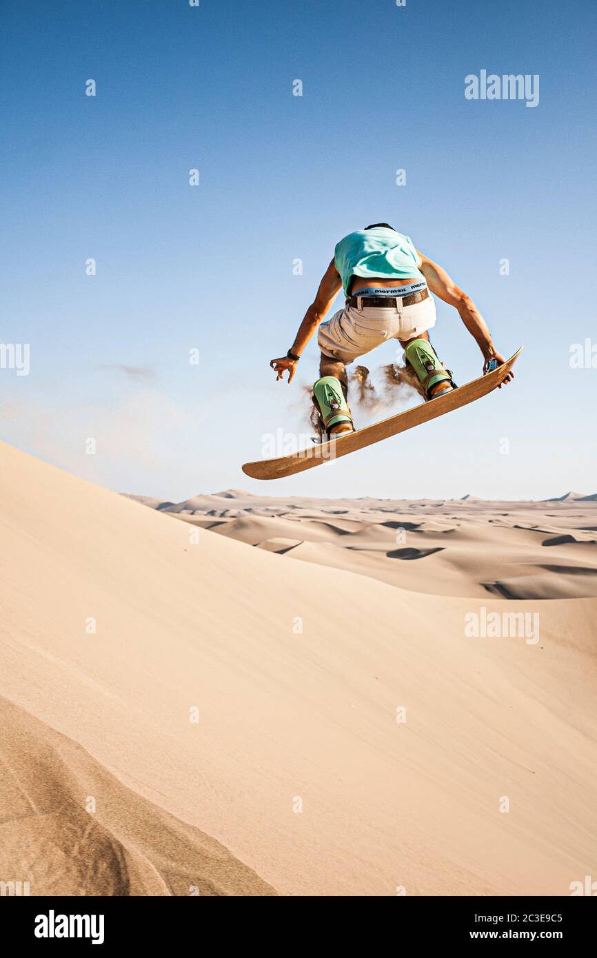 Sandboarding on Huacachina Desert. Ica, Ica Region, Peru Stock Photo ...