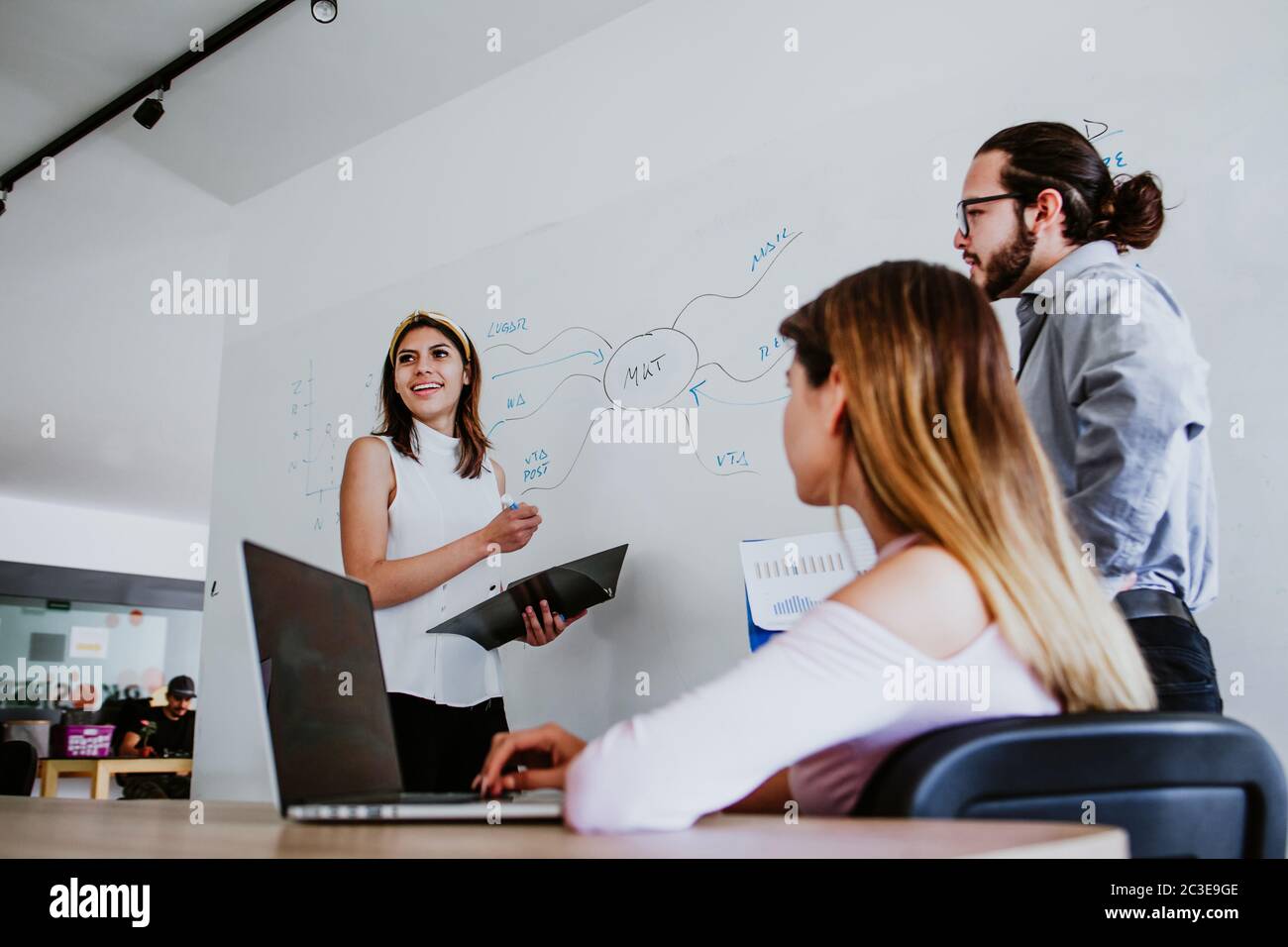 young latin woman working in at office in a business meeting in Mexico ...