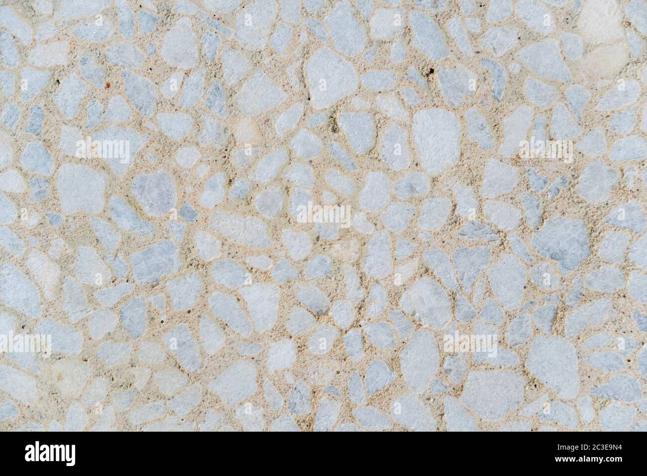 Decorative beige tile on the facade of the building as a background or ...