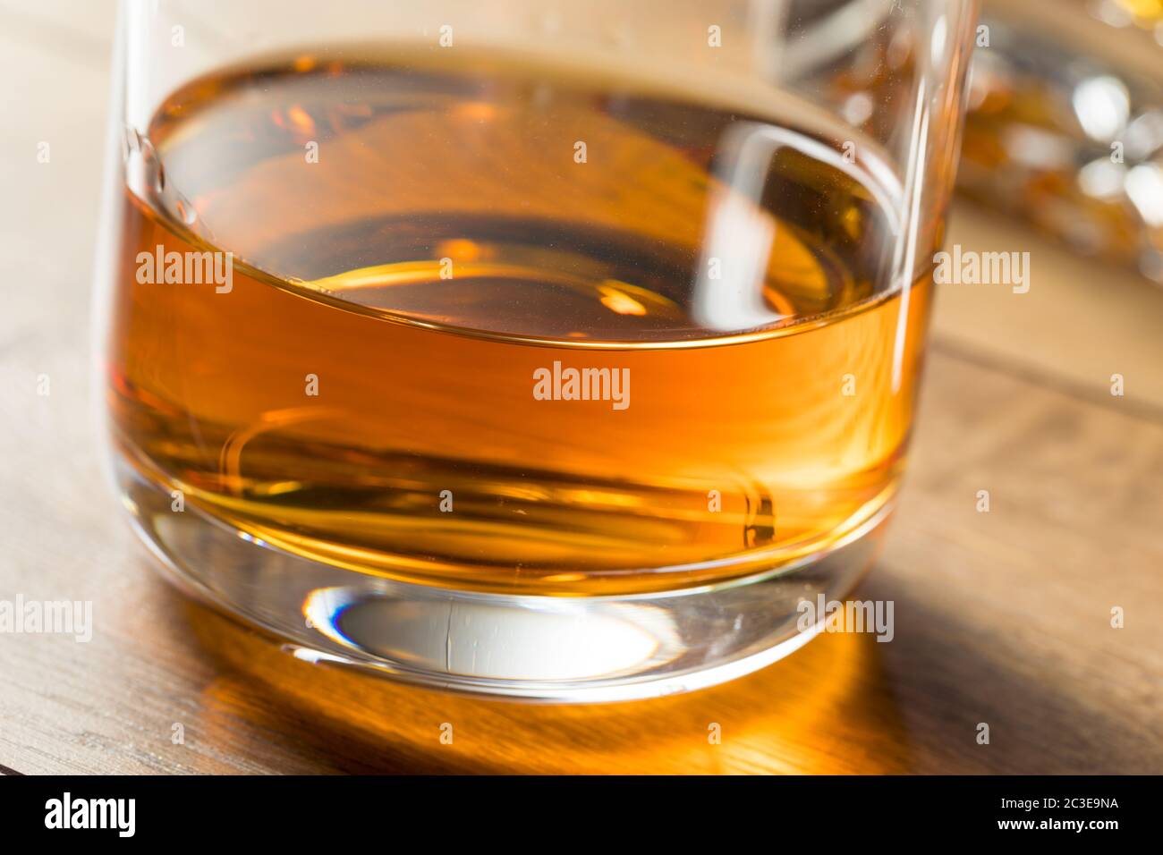 Boozy Alcoholic Whiskey Neat in a Rocks Glass Stock Photo - Alamy