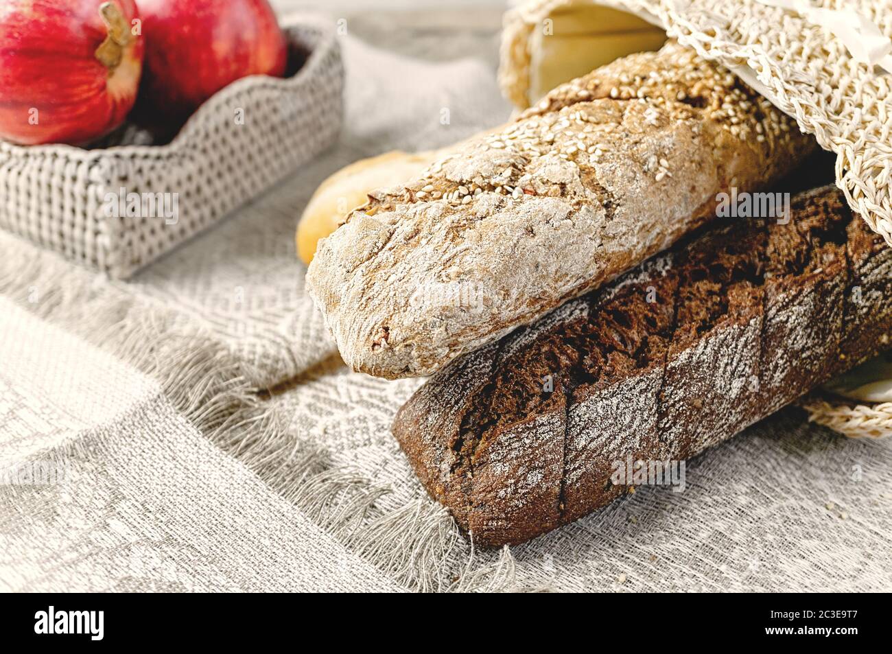 Different types of home-baked bread are on the table. Food background ...