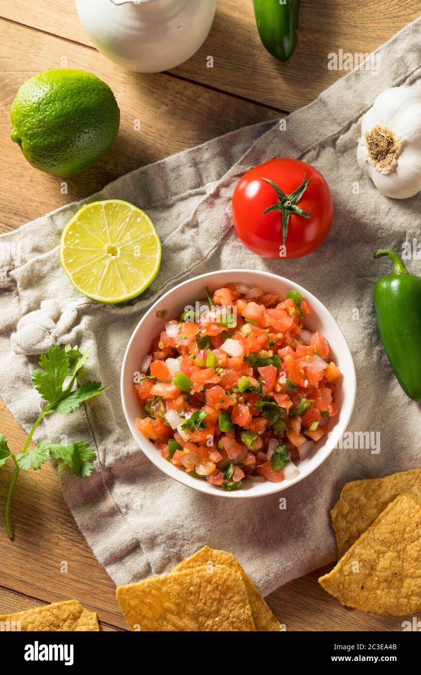 Spicy Homemade Pico De Gallo with Cilantro and Chips Stock Photo - Alamy