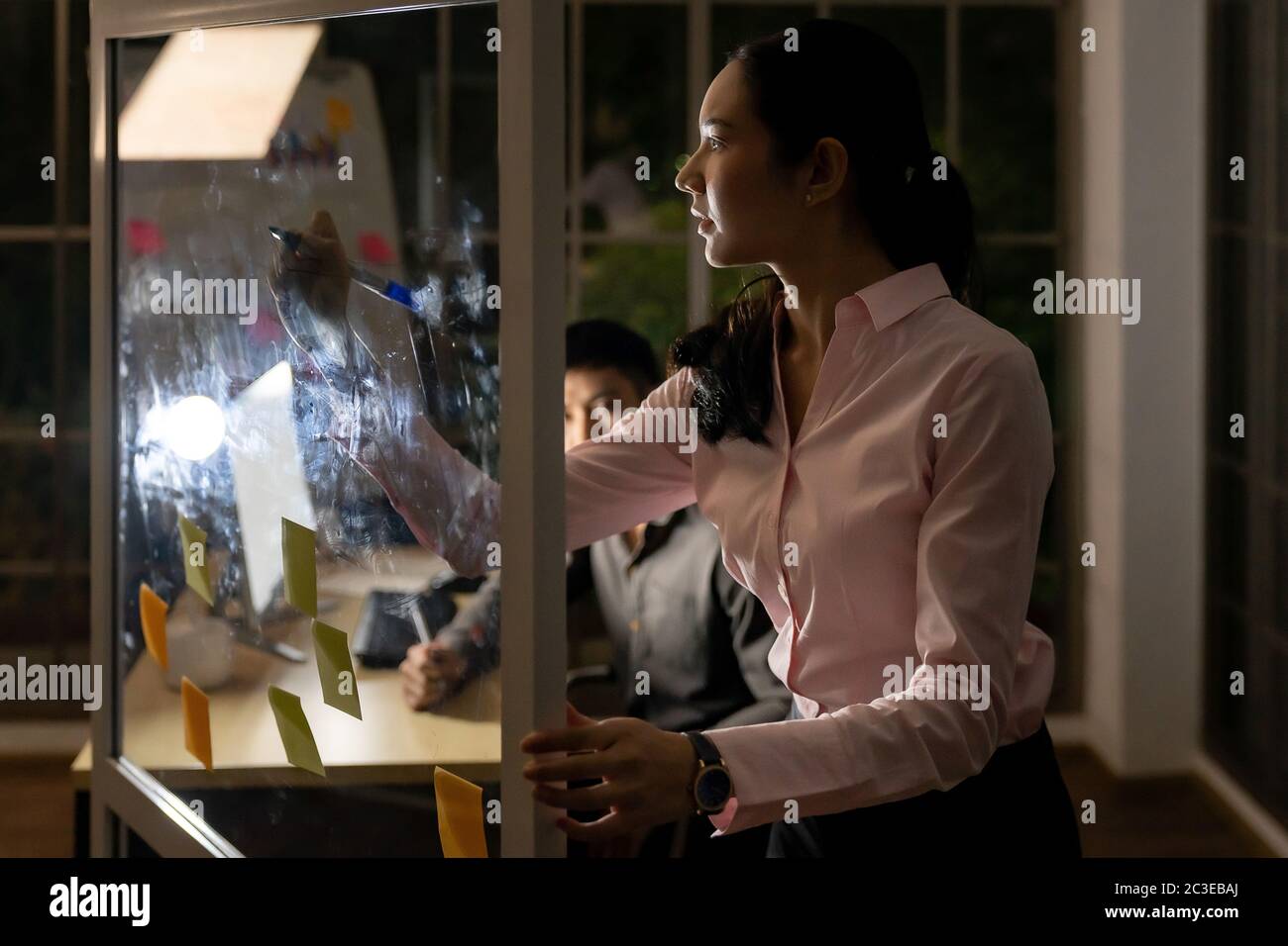 Teamwork analysis and working Late at night Stock Photo - Alamy
