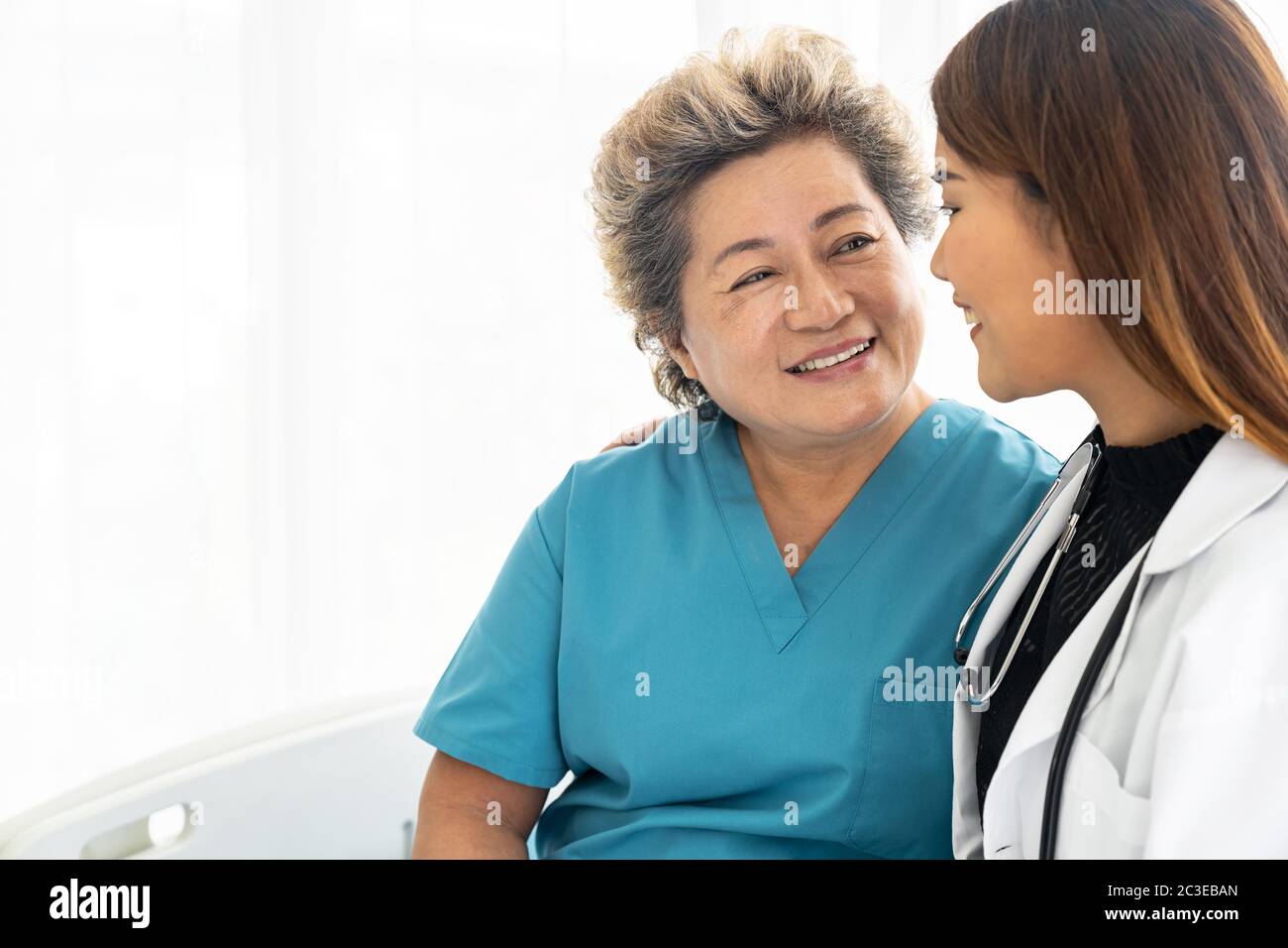 doctor hugging elderly patient Stock Photo - Alamy
