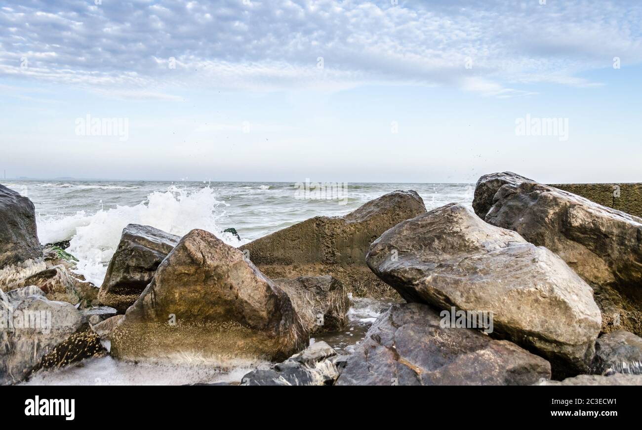 Rocks surf and clouds hi-res stock photography and images - Alamy